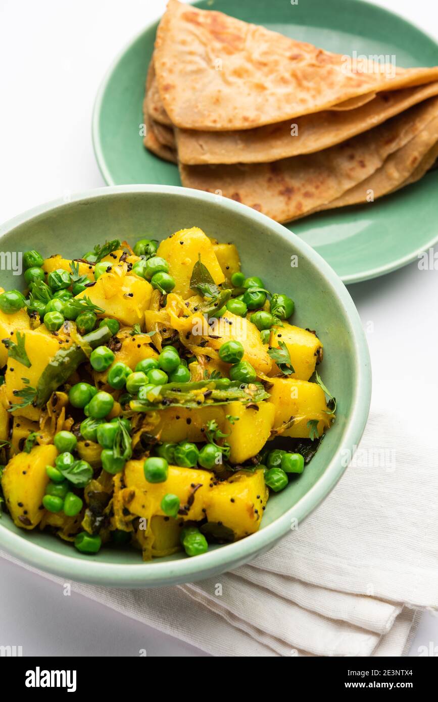 Aloo Mutter or Matar aalu dry sabzi, Indian Potato and green Peas fried ...