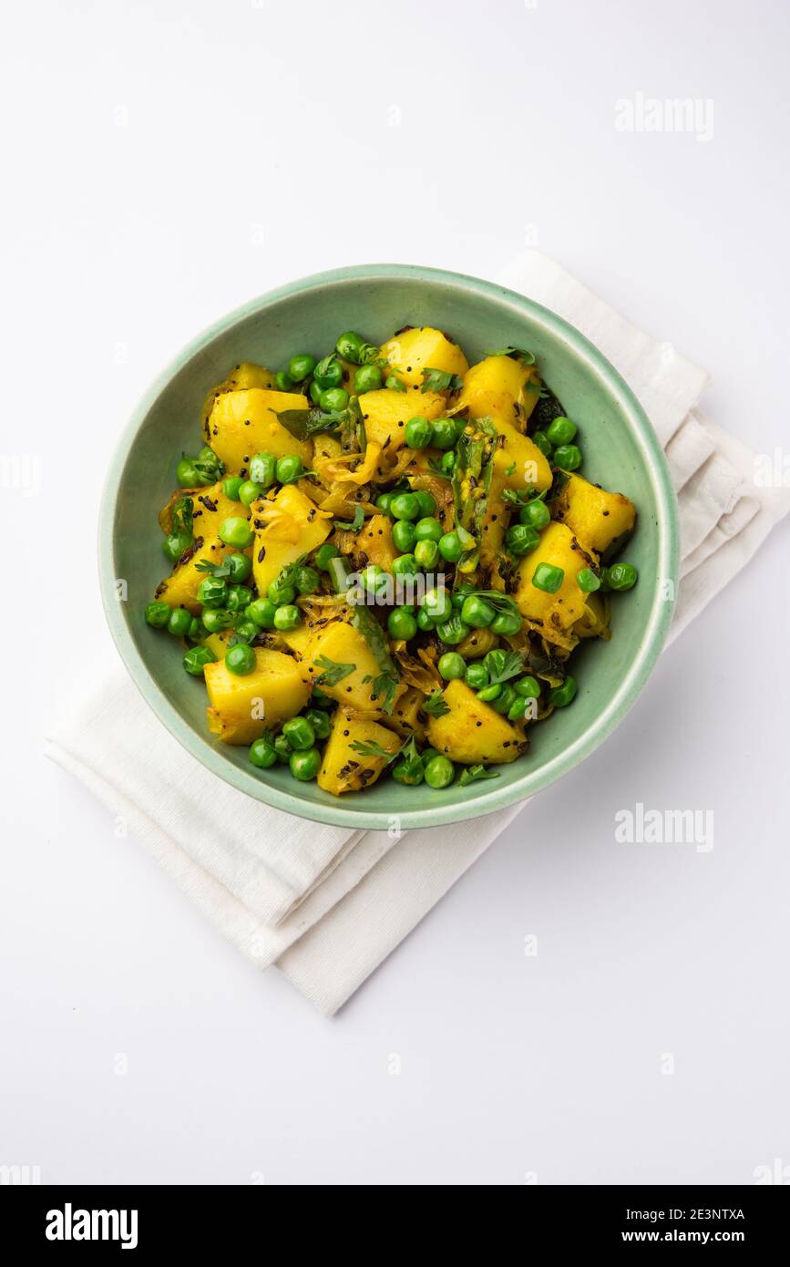 Aloo Mutter or Matar aalu dry sabzi, Indian Potato and green Peas fried ...