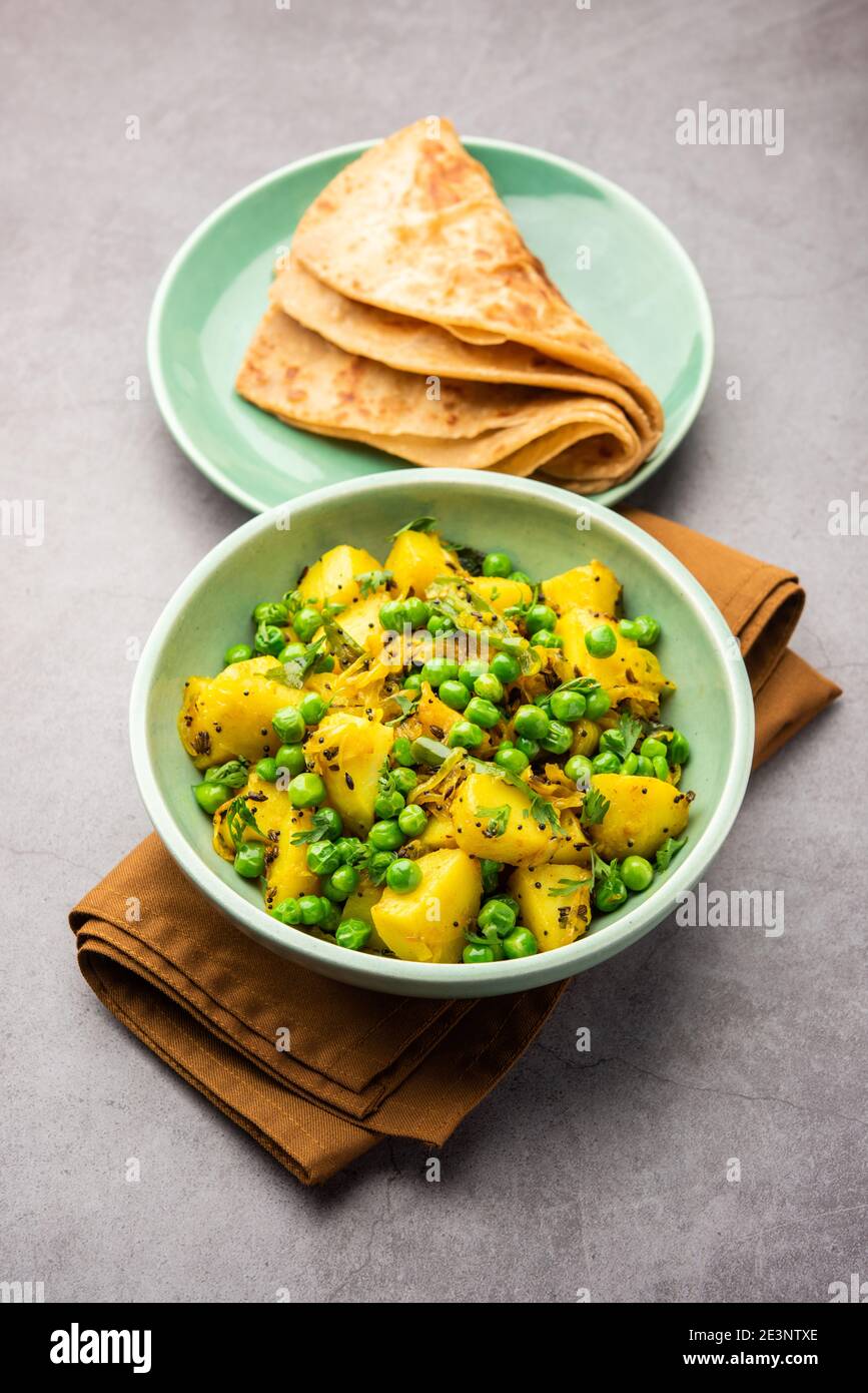 Aloo Mutter or Matar aalu dry sabzi, Indian Potato and green Peas fried ...