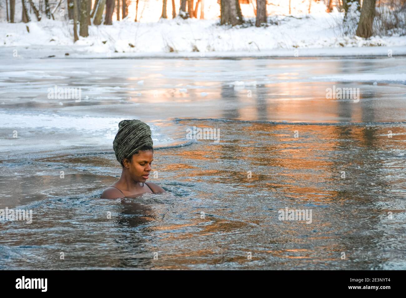Beautiful Girl Enjoying Winter And Swimming In The Cold Water Of A Lake Or River Cold Therapy