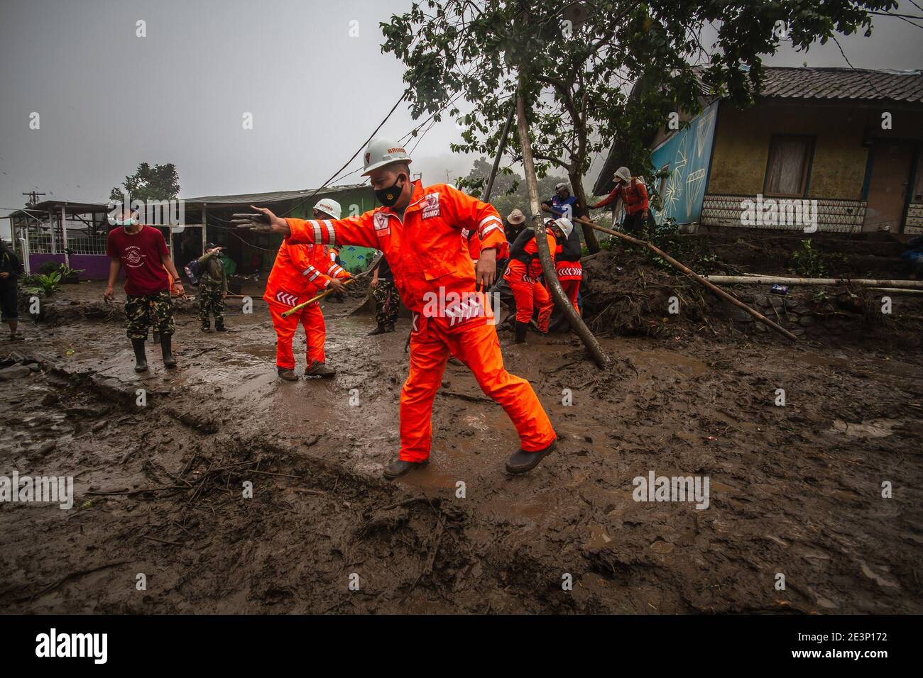 Bogor, West Java, Indonesia. 20th Jan, 2021. Residents clean up mud after flash floods in the ...