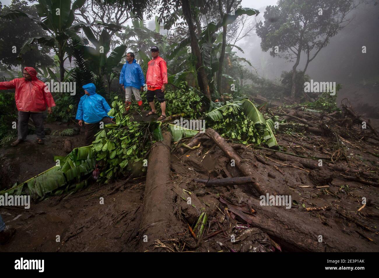 Bogor, West Java, Indonesia. 20th Jan, 2021. Residents clean up mud after flash floods in the ...