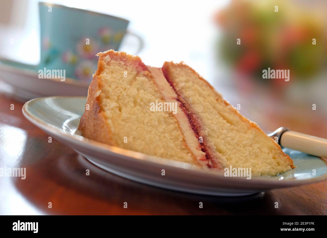 slice of victoria sponge cake and blurred background Stock Photo - Alamy