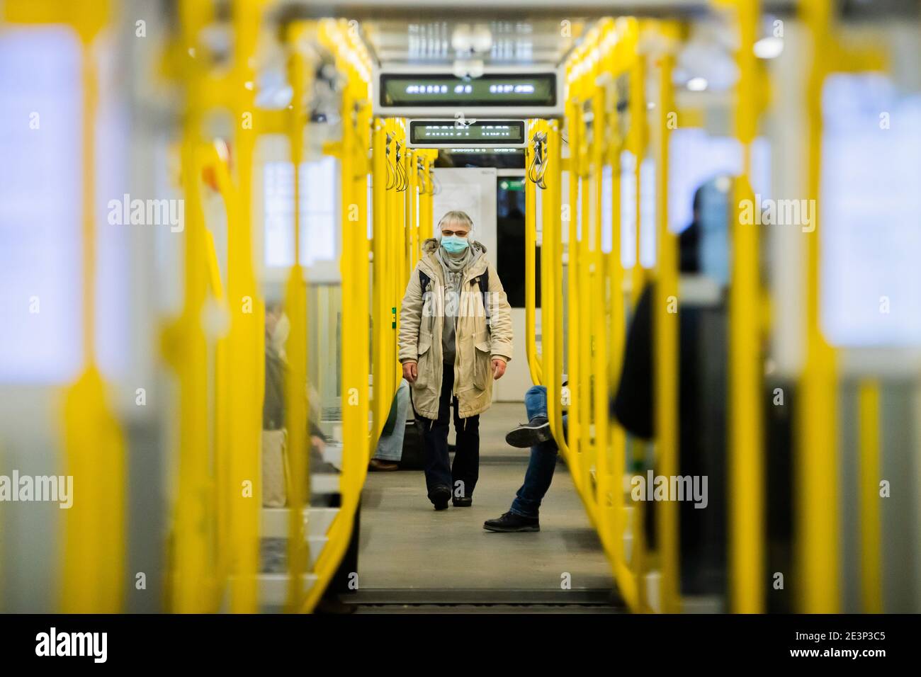 Berlin, Germany. 20th Jan, 2021. A woman gets on the subway wearing a ...