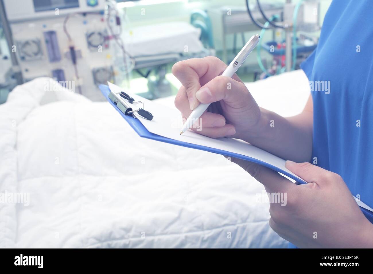 Healthcare worker writing patient notes hi-res stock photography and ...