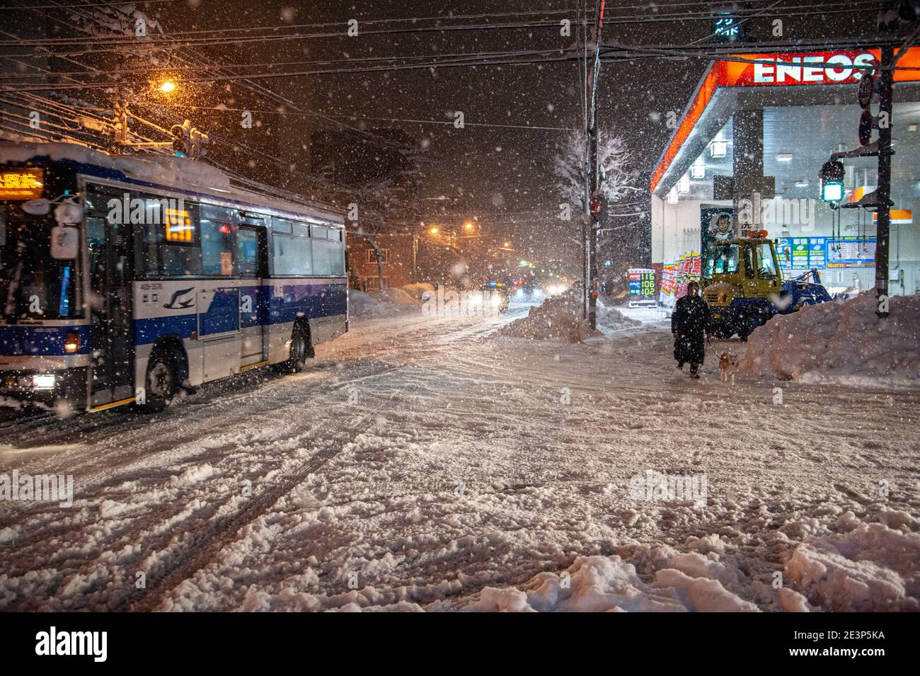 Heavy snowfall at night in a Japanese city Stock Photo - Alamy