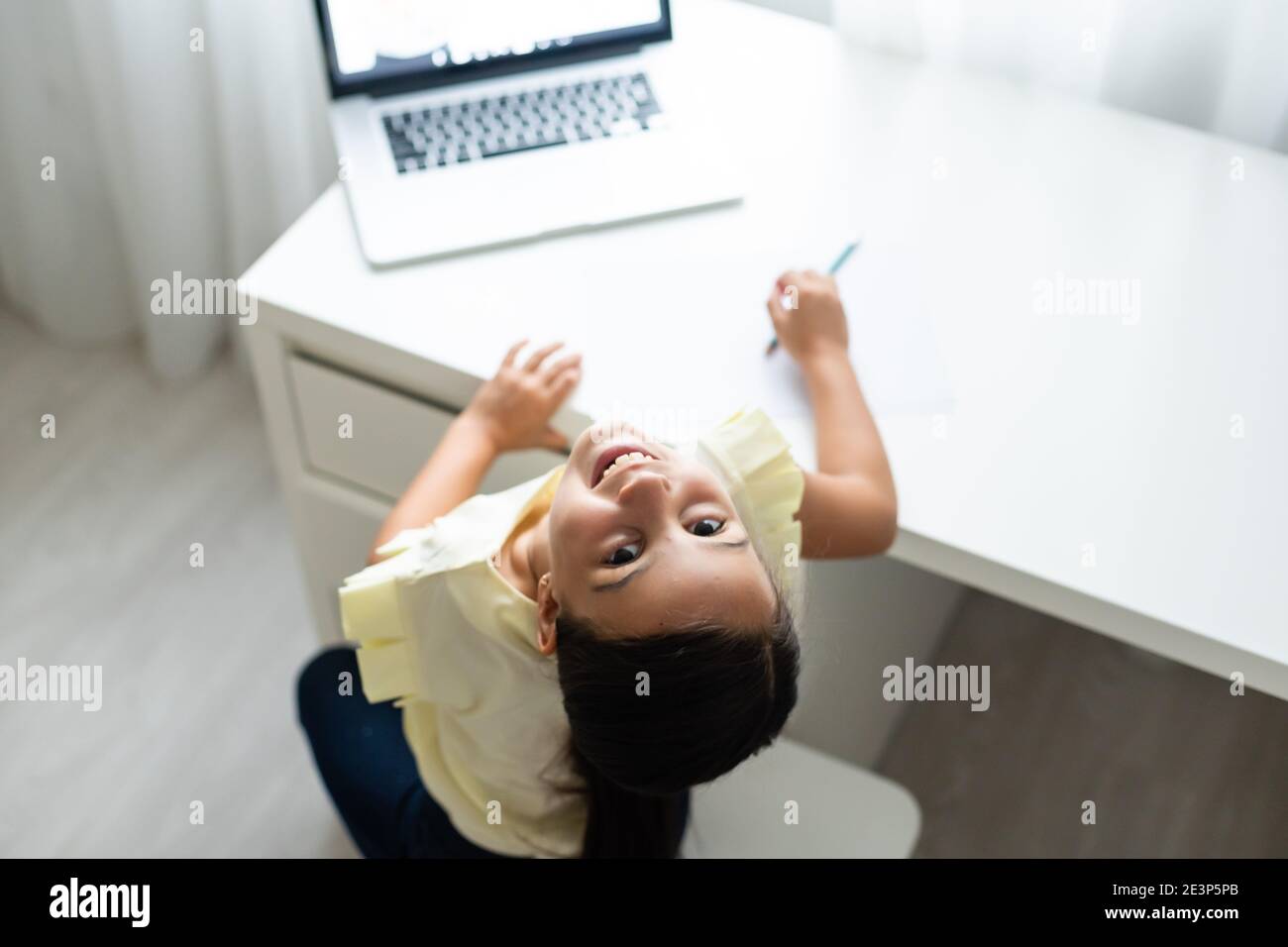 cheerful young little girl children using laptop computer, studying ...