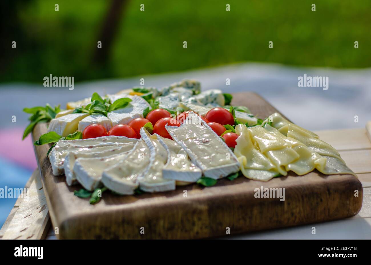 Cheese platter during a banquet outside Stock Photo - Alamy
