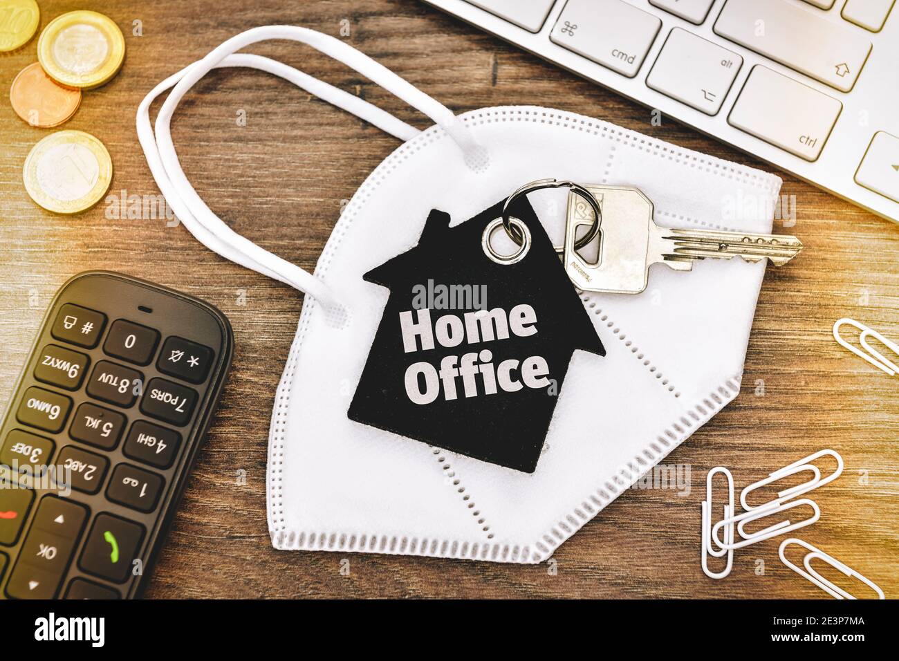 Home office key ring, face mask and computer keyboard Stock Photo - Alamy