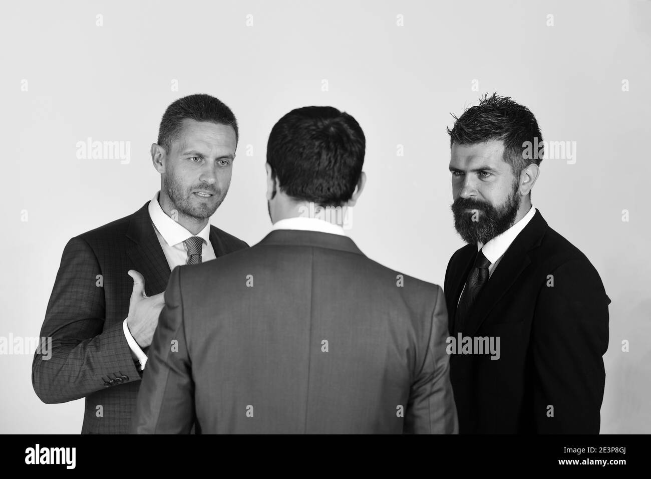 Businessmen wear smart suits and ties. Leaders have argument on light ...