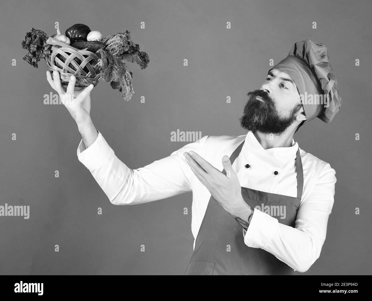 Vegetarian restaurant concept. Man with beard on green background. Cook ...