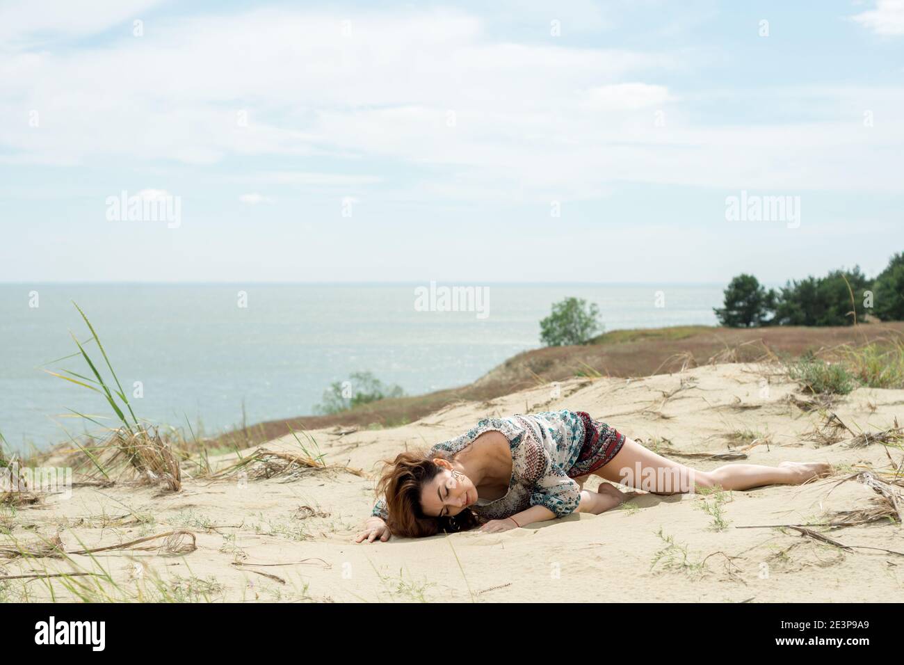 Woman lying on the ground, intimacy with nature Stock Photo - Alamy
