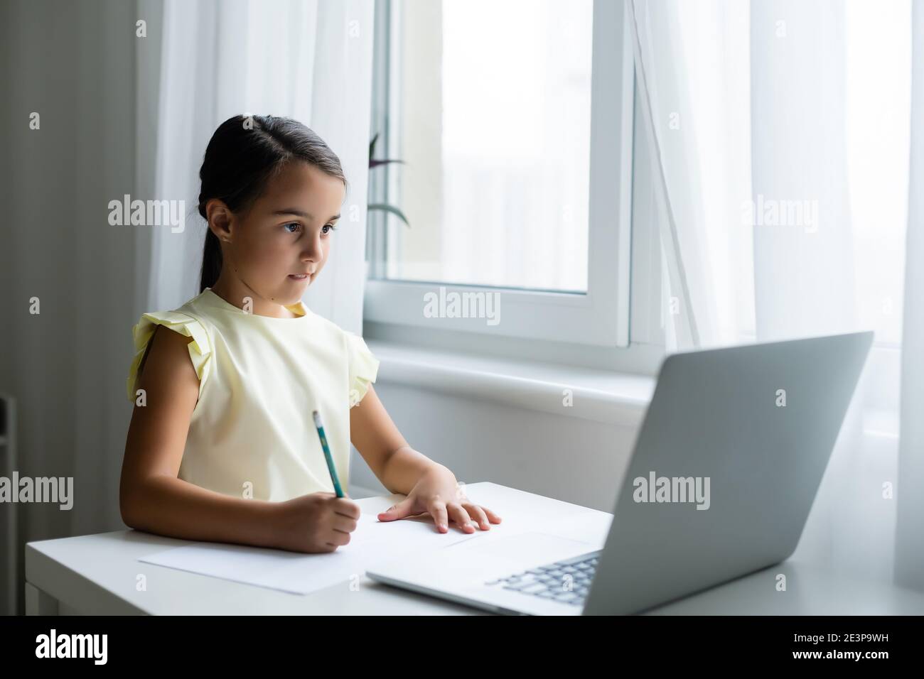 home, leisure, technology and internet concept - little student girl ...