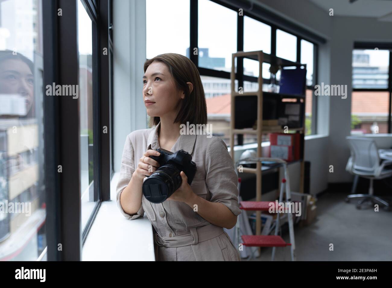 Asian holding camera hi-res stock photography and images - Alamy