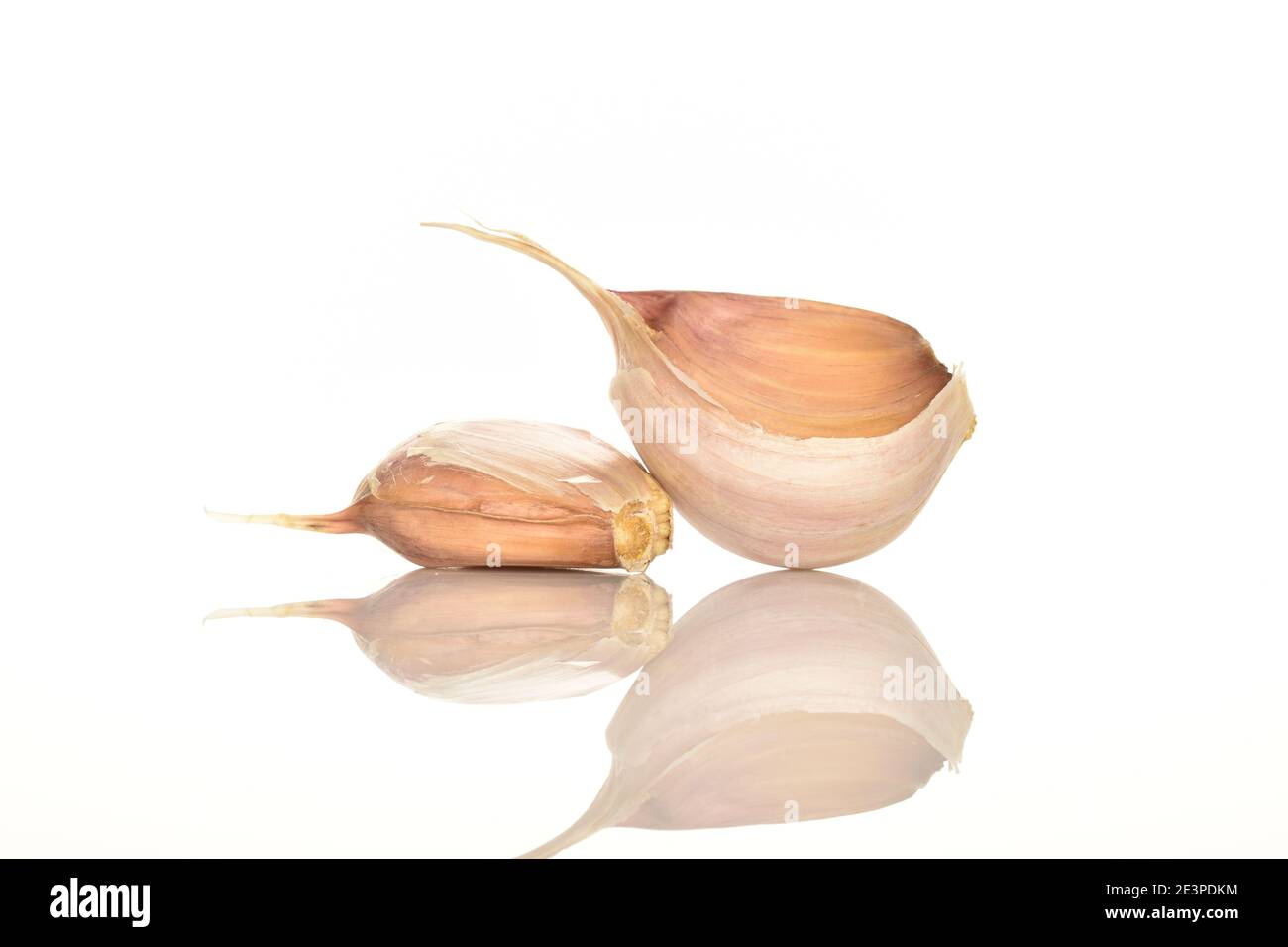 Two cloves of spicy fresh fragrant garlic on a white background Stock ...