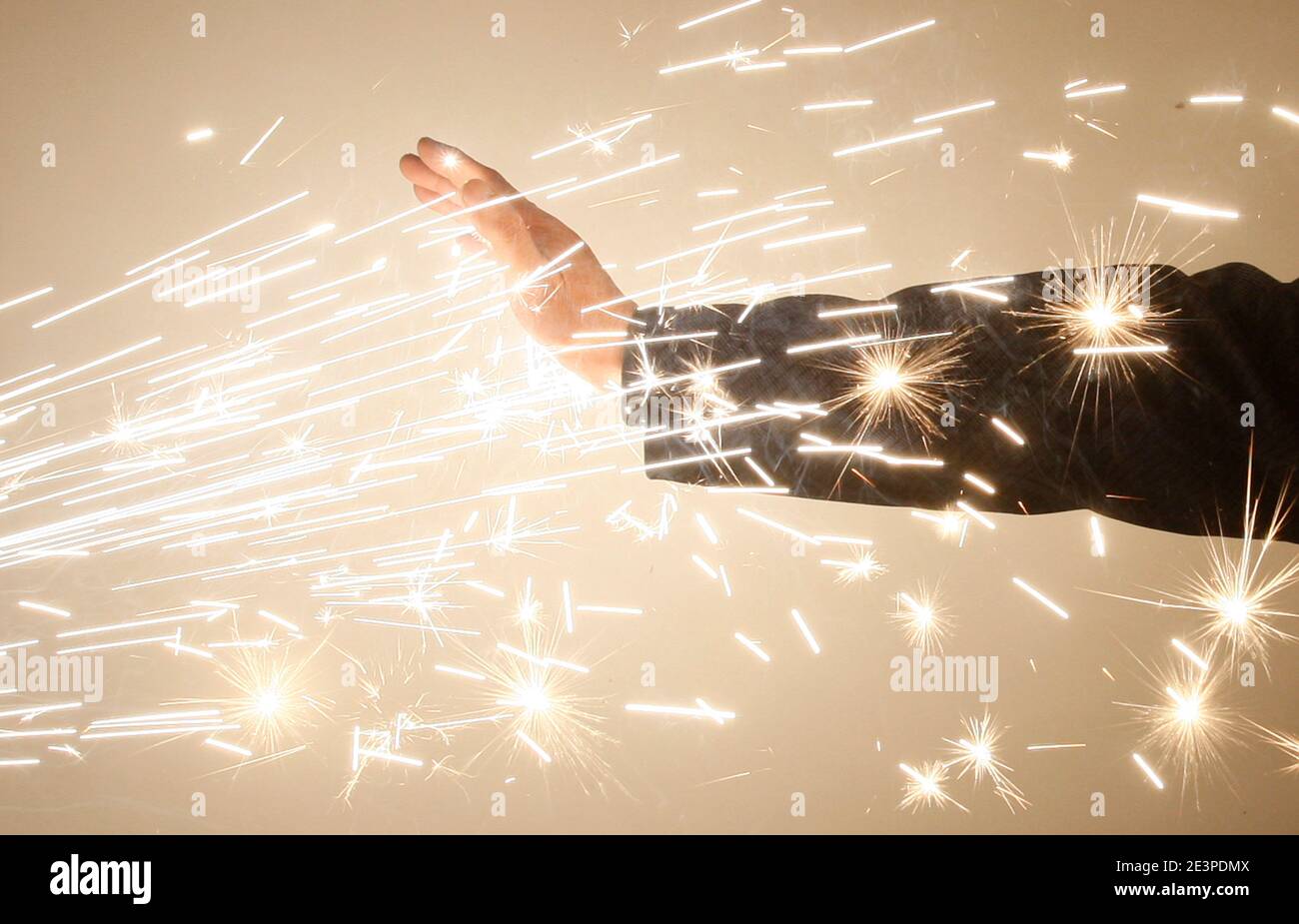A person's hand and fireworks high quality photo Stock Photo - Alamy