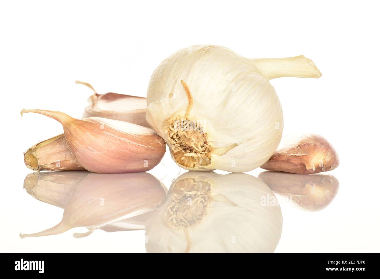 One whole head and several cloves of spiced fresh fragrant garlic on a ...