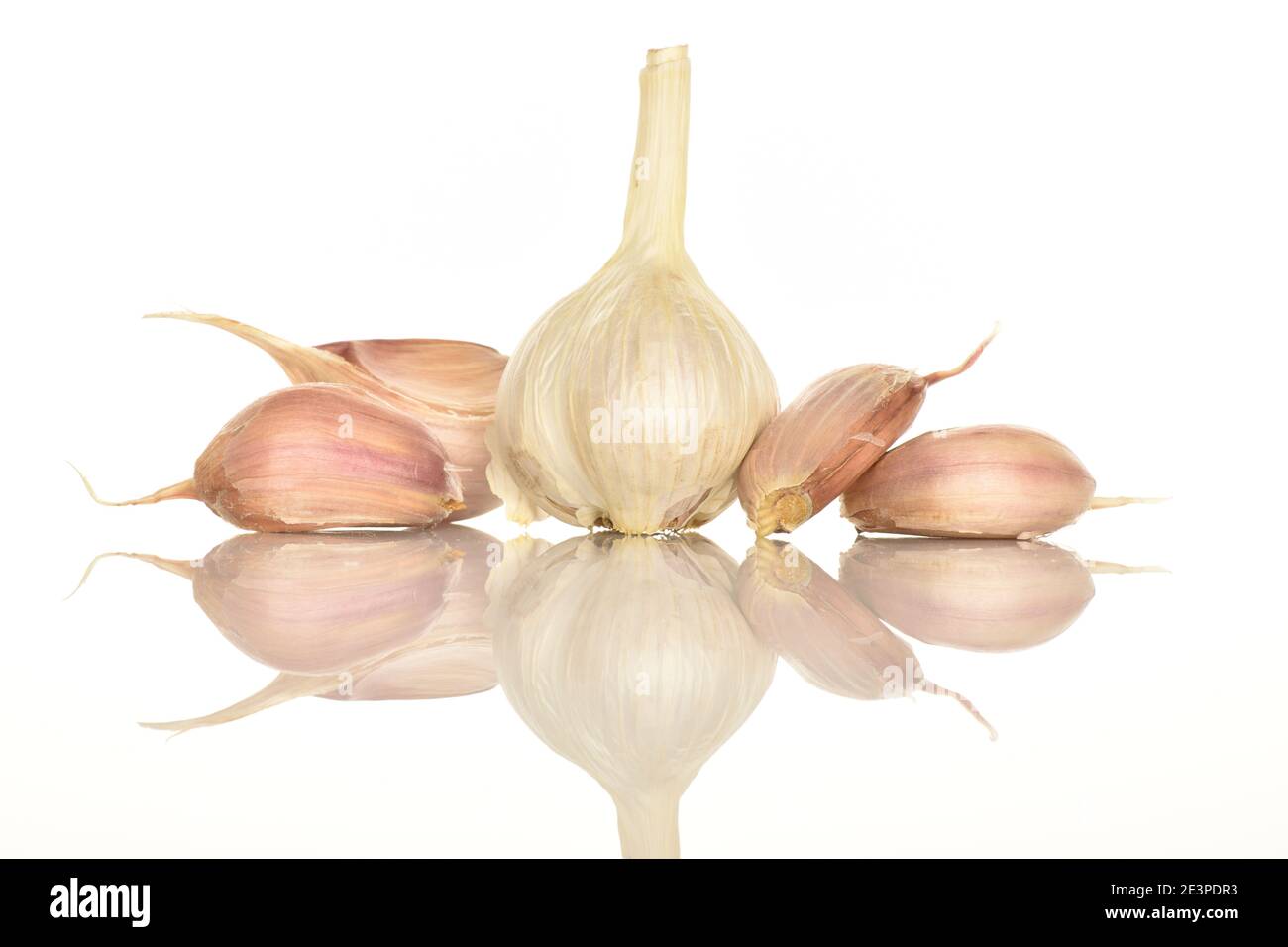 One whole head and several cloves of spiced fresh fragrant garlic on a ...