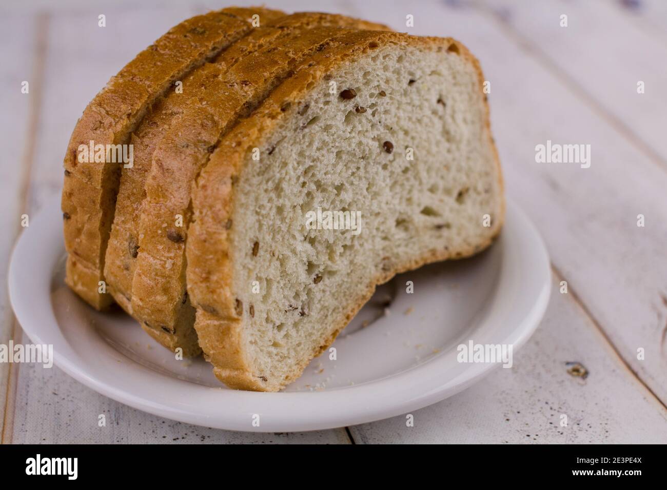 a sliced bread on a wooden a table Stock Photo - Alamy