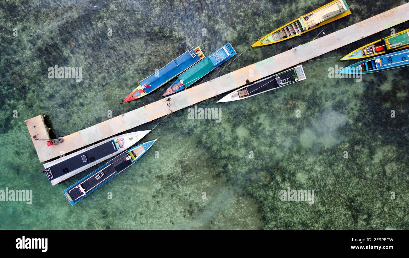 Aerial view of top down picture of colorful wooden boats. Boats at the ...
