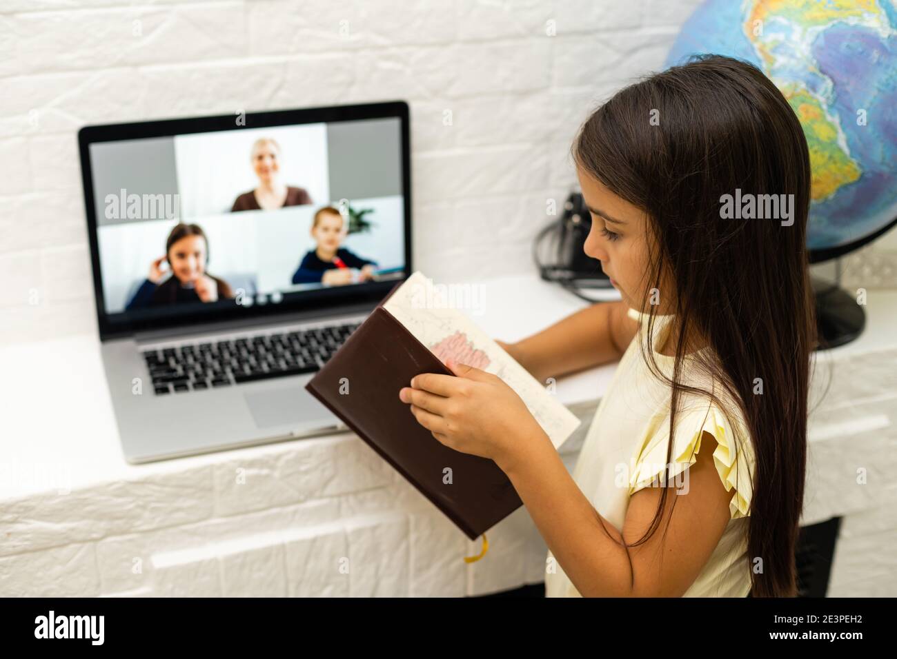 cheerful young little girl children using laptop computer, studying ...