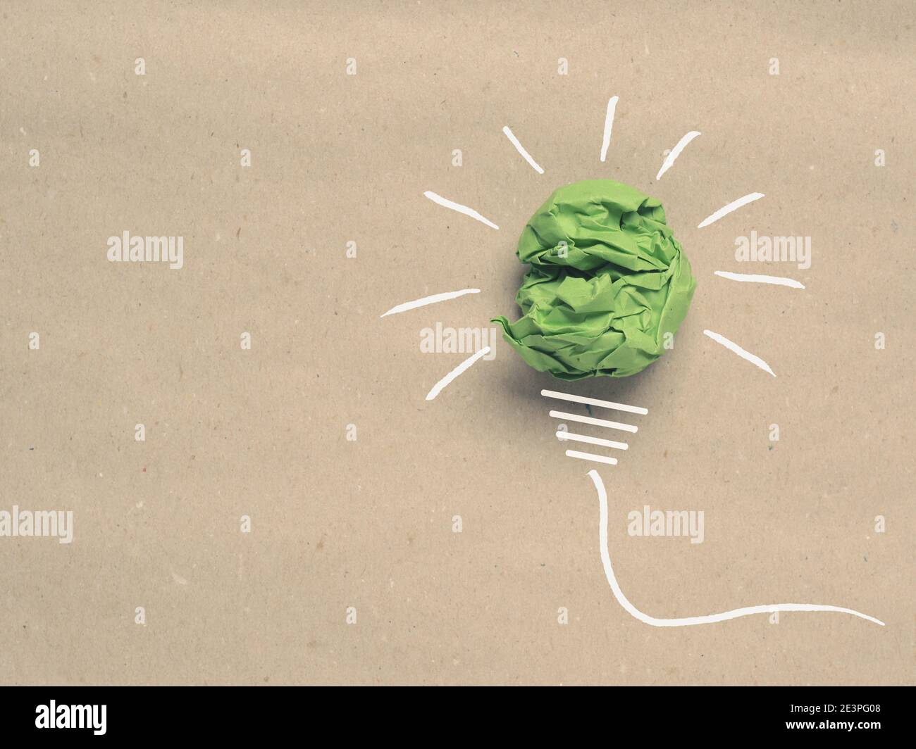 Recycled paper background with green crumpled paper ball as light bulb ...