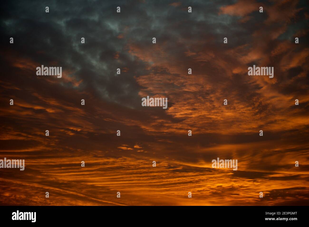 No fake dramatic sunset with clouds in orange Stock Photo - Alamy