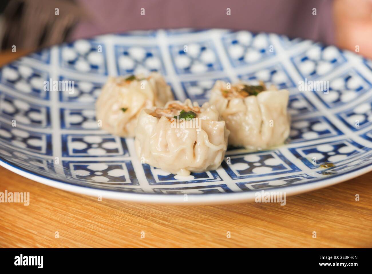 close up of steamed dim sum in a bowl Stock Photo - Alamy