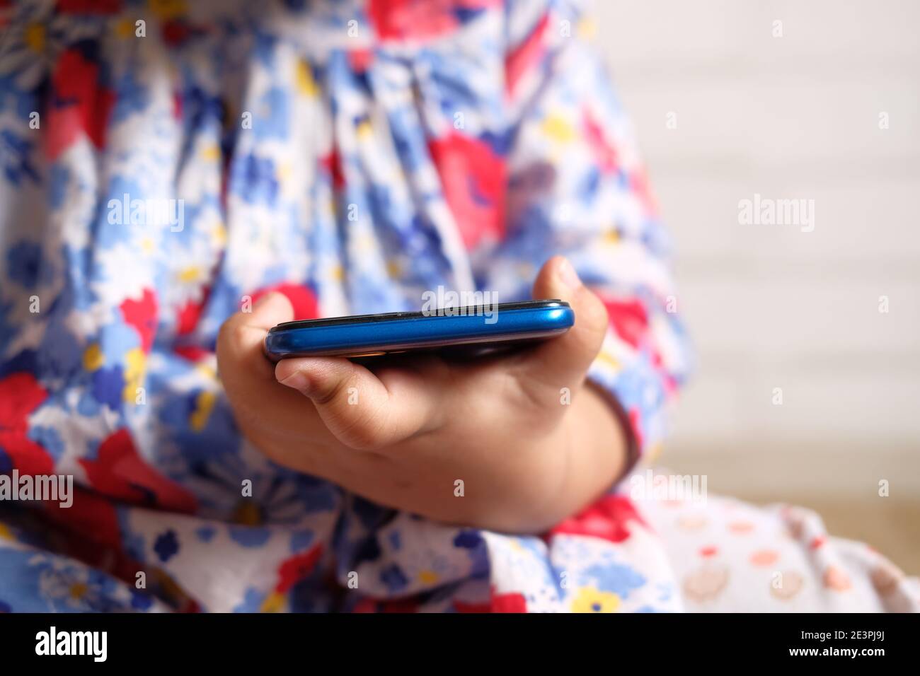 Child girl watching cartoon on smart phone Stock Photo - Alamy