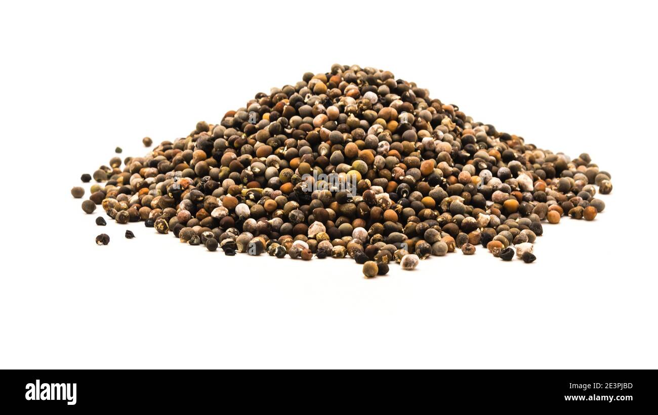 Mound of homegrown okra seeds isolated on white background. Organic and ...