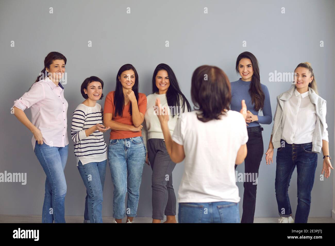 Happy women listening to an interesting motivational speech by ...