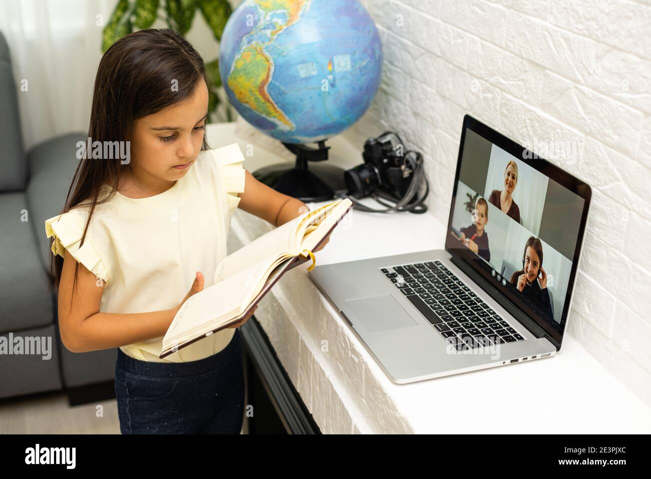 home, leisure, technology and internet concept - little student girl ...