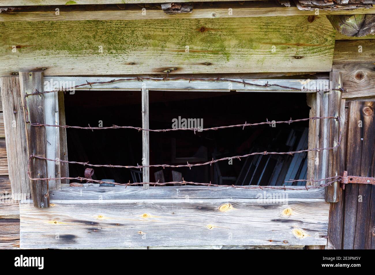 Window with barbed wire on an old shed Stock Photo - Alamy