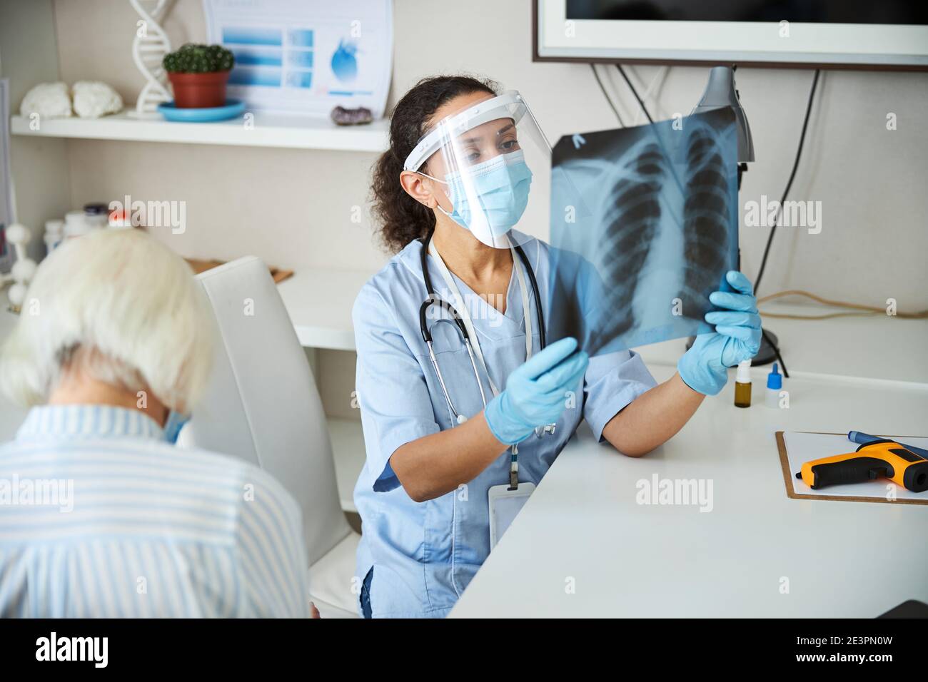 Female doctor holding radiograph film hi-res stock photography and ...