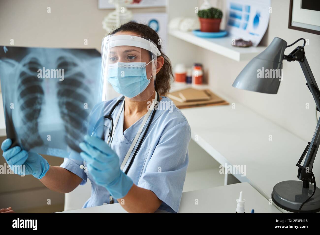 Medical worker looking for the abnormalities in an x-ray Stock Photo ...