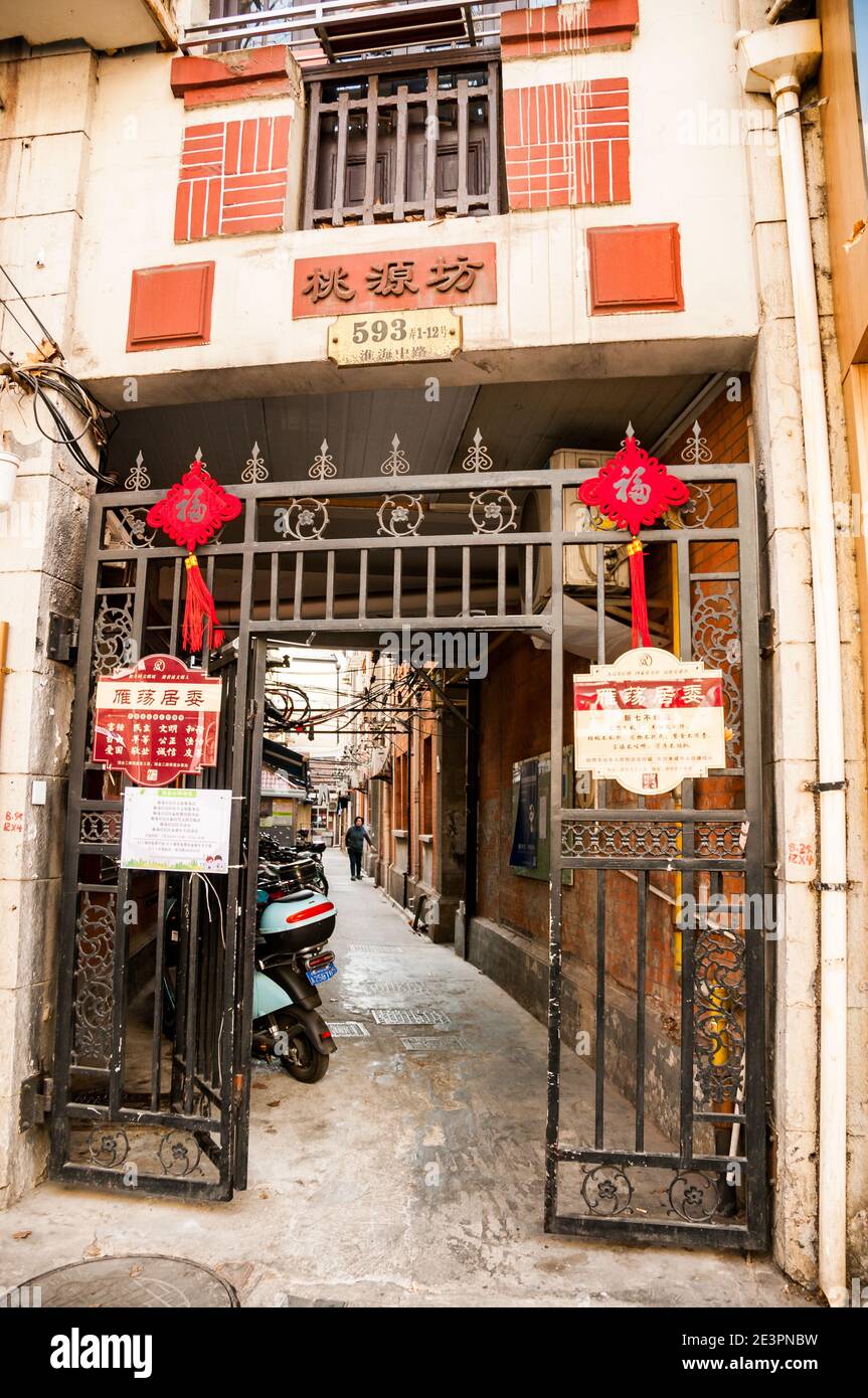 Gateway to an alleyway of traditional shikumen houses off central Huai ...