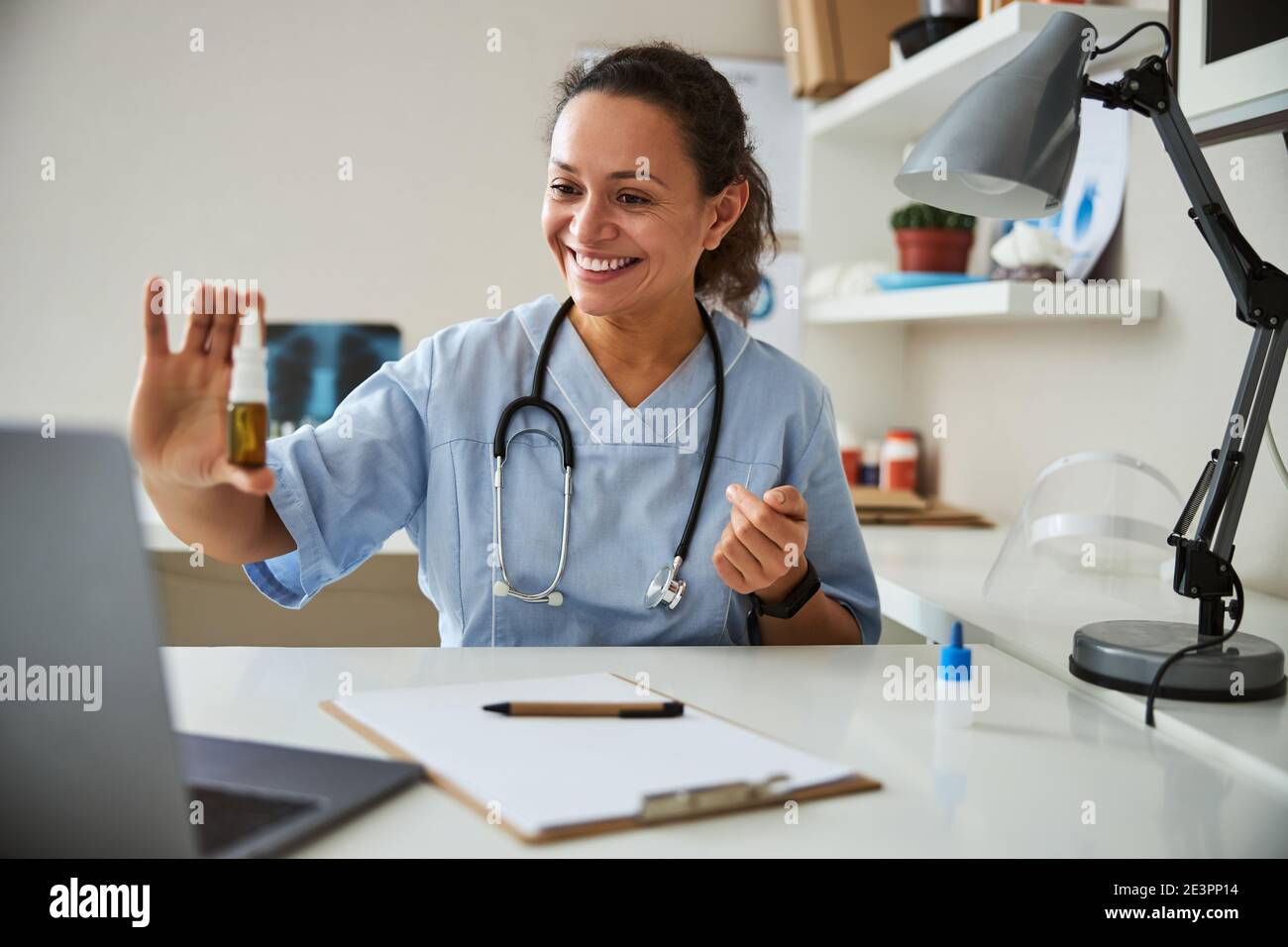 Lively doctor keeping a nasal spray bottle Stock Photo - Alamy