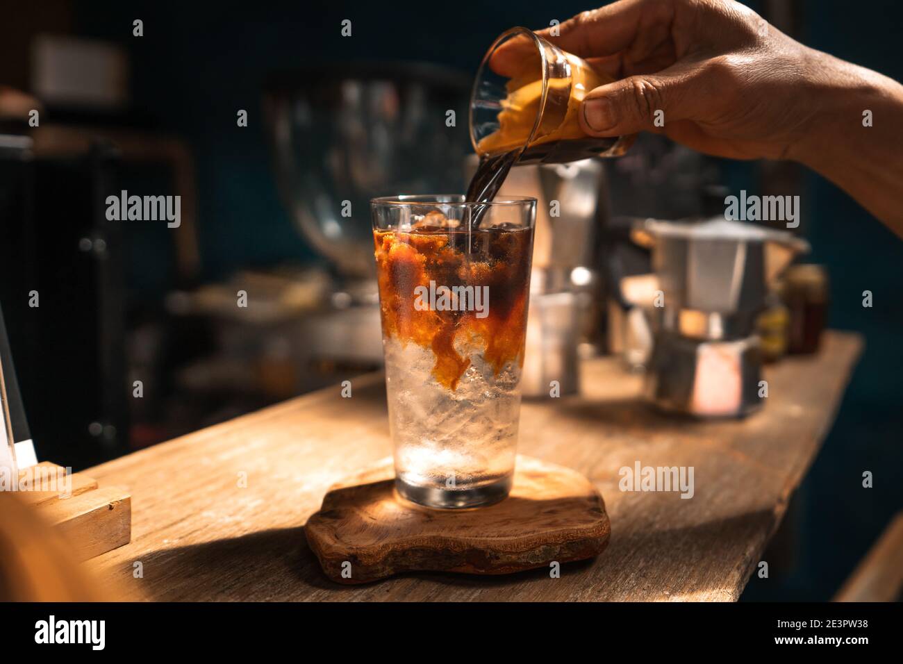 Iced Americano coffee in a glass on a bar in a cafe Stock Photo - Alamy