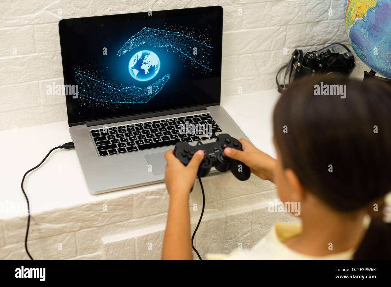Little girl playing computer games, Kids addicted to the game concept ...