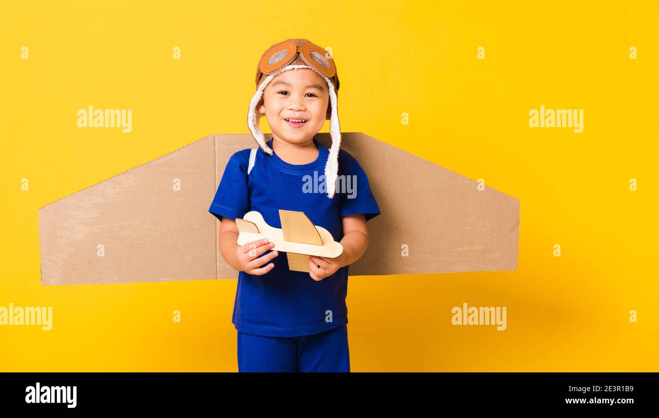 Happy Asian handsome funny child or kid little boy smile wear pilot hat ...