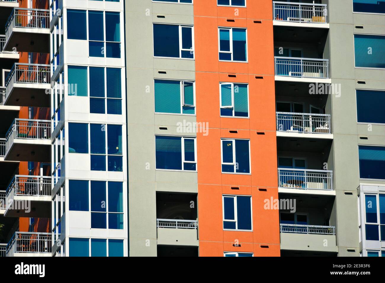 Urban residential building facade with concrete walls and symmetrical ...