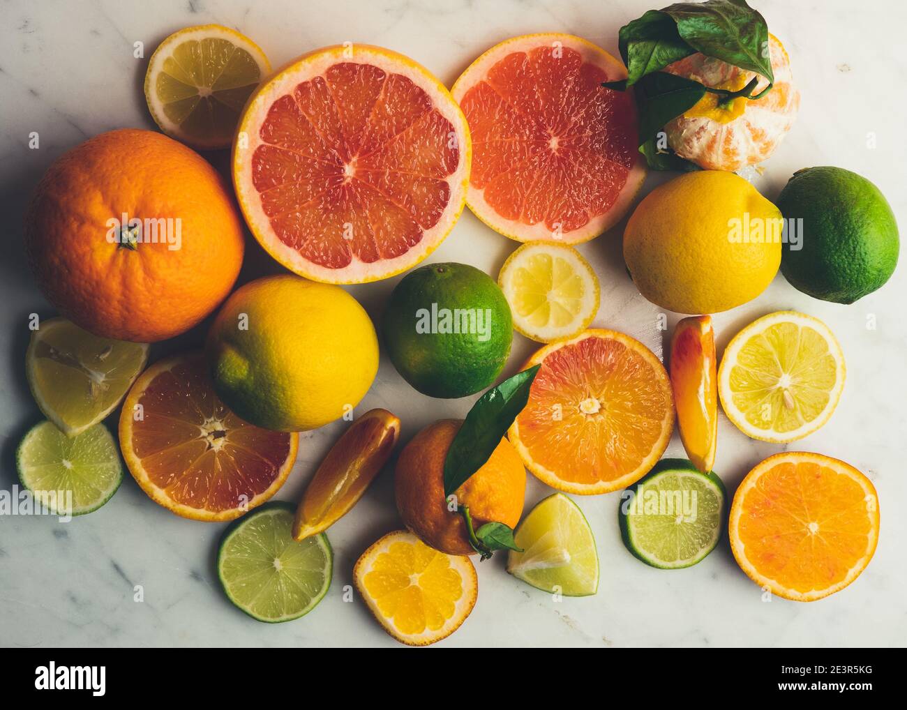 Colorful fruit background top view. Mix of red orange, lime, lemon ...
