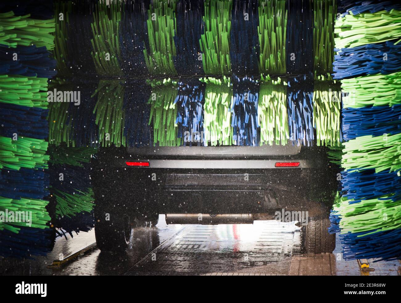 Grey car during washing process Stock Photo - Alamy