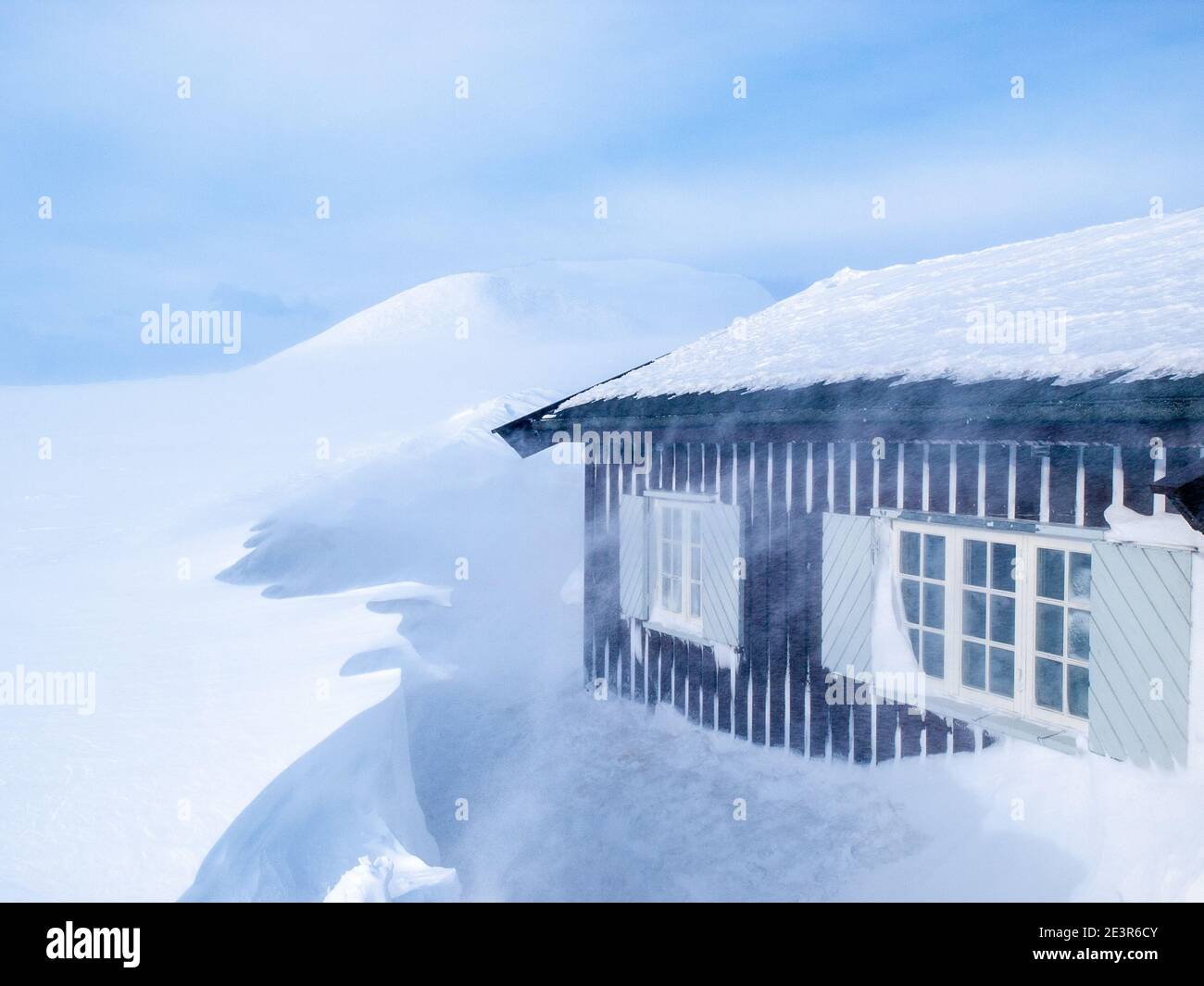 A DNT mountain cabin in winter blizzard, Rondane National Park, Norway ...