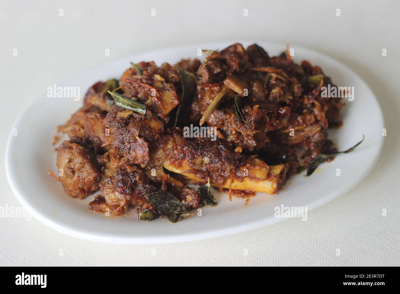 Spicy mutton roast prepared in Kerala style for special occasions like ...