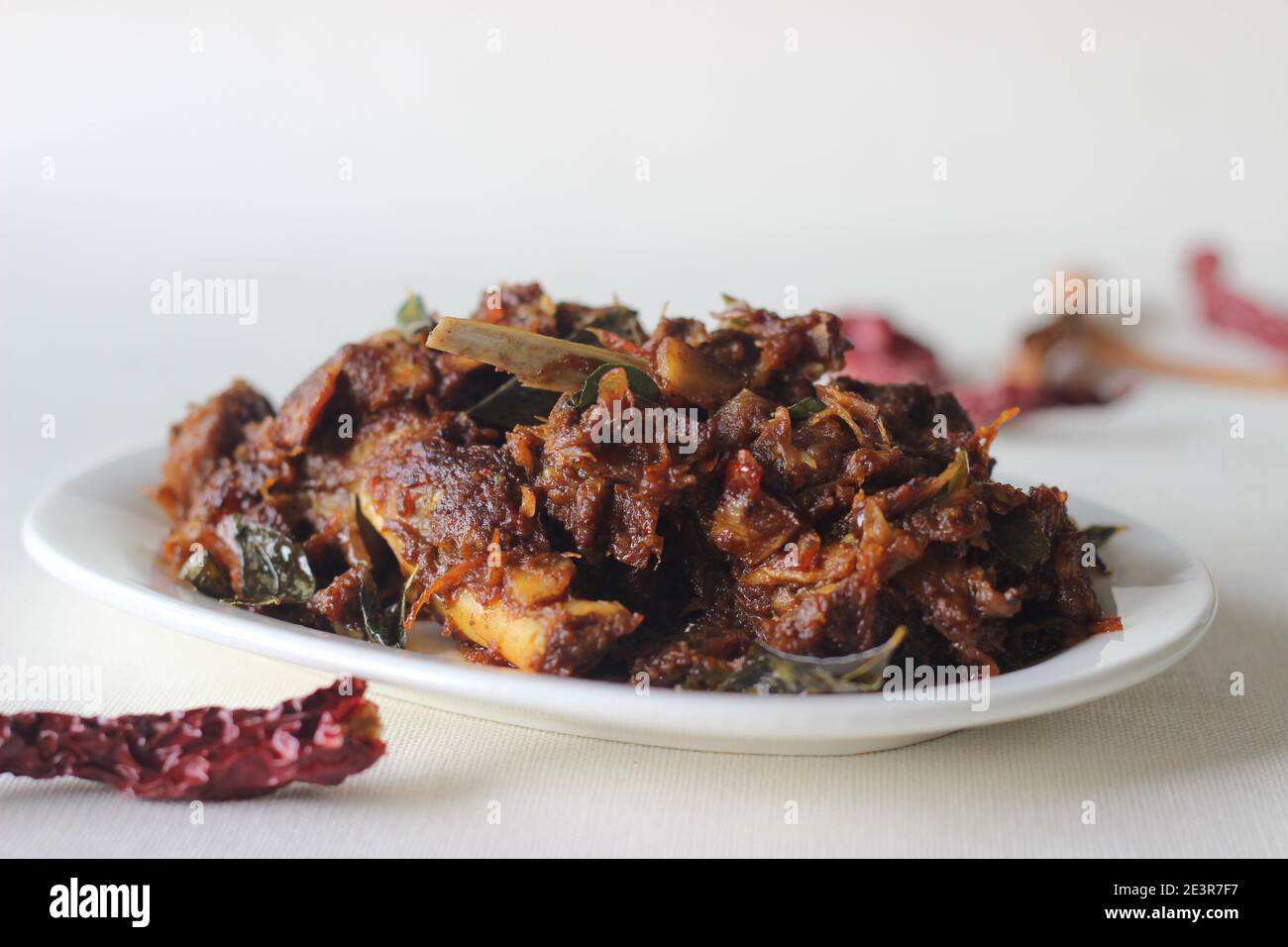 Spicy mutton roast prepared in Kerala style for special occasions like ...