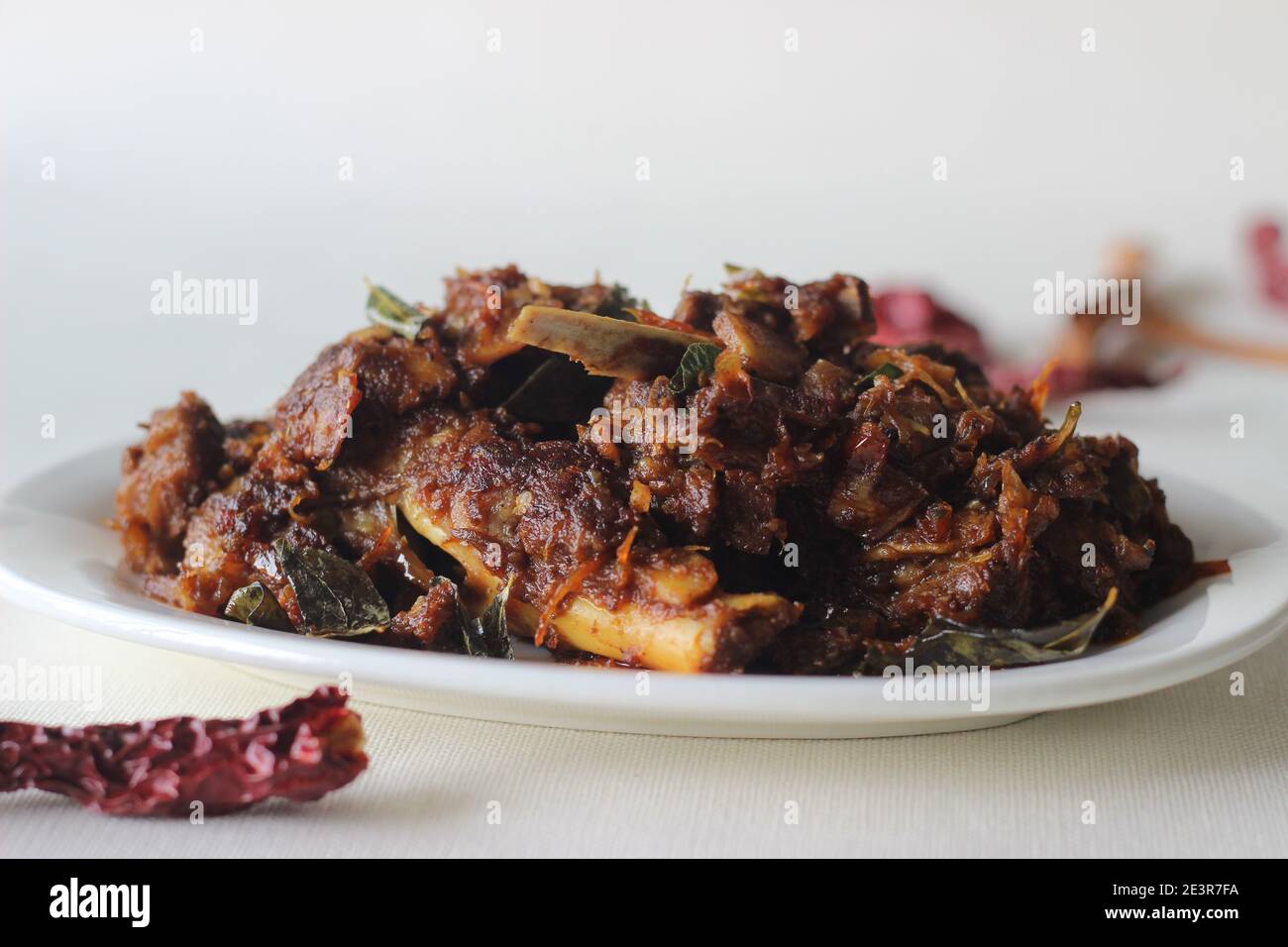 Spicy mutton roast prepared in Kerala style for special occasions like ...