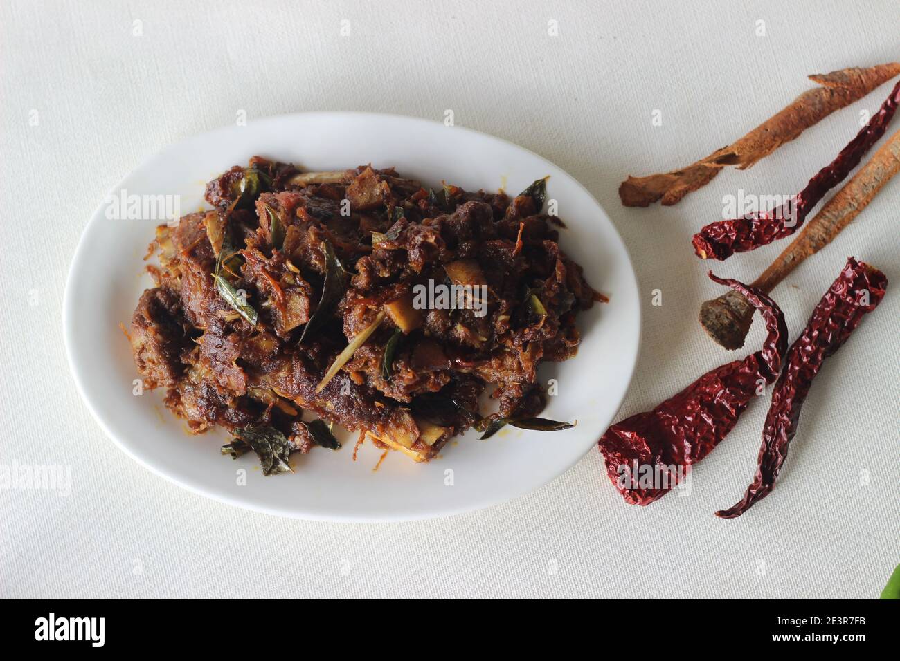 Spicy mutton roast prepared in Kerala style for special occasions like ...