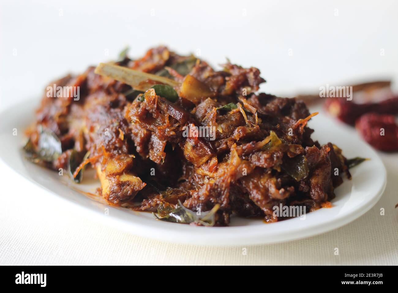 Spicy mutton roast prepared in Kerala style for special occasions like ...