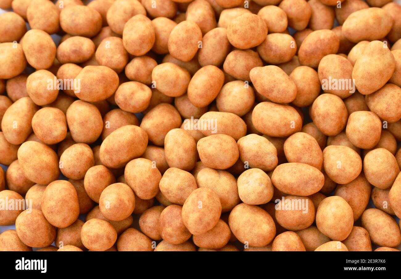crispy sweet peanut coating coconut milk arranging on white background ...